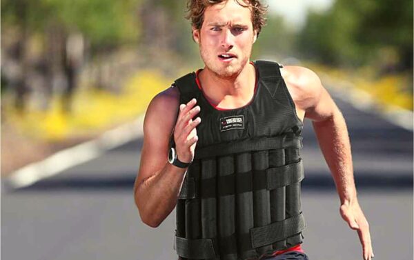 Running With Weights: Pros, Cons + How To Do So Safely