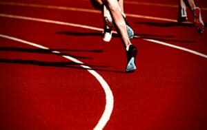 How To Run A 4-Minute Mile: Speed, Strength, + Workouts