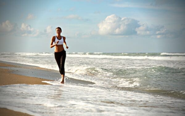 Running On The Beach: Sand Running Benefits + 10 Helpful Tips