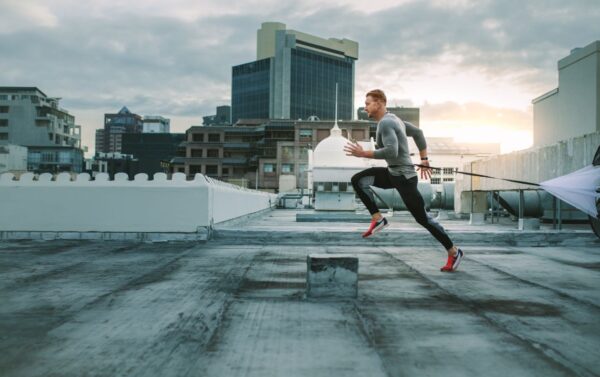 Running With Weights: Pros, Cons + How To Do So Safely